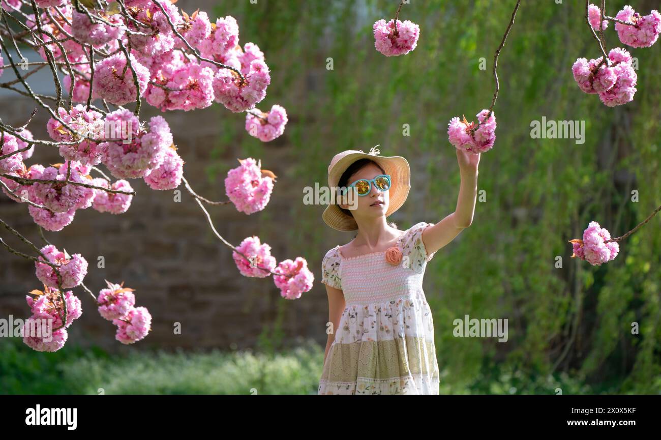 Photograph posed by model. Maja Lawson enjoys the blossoms in ...
