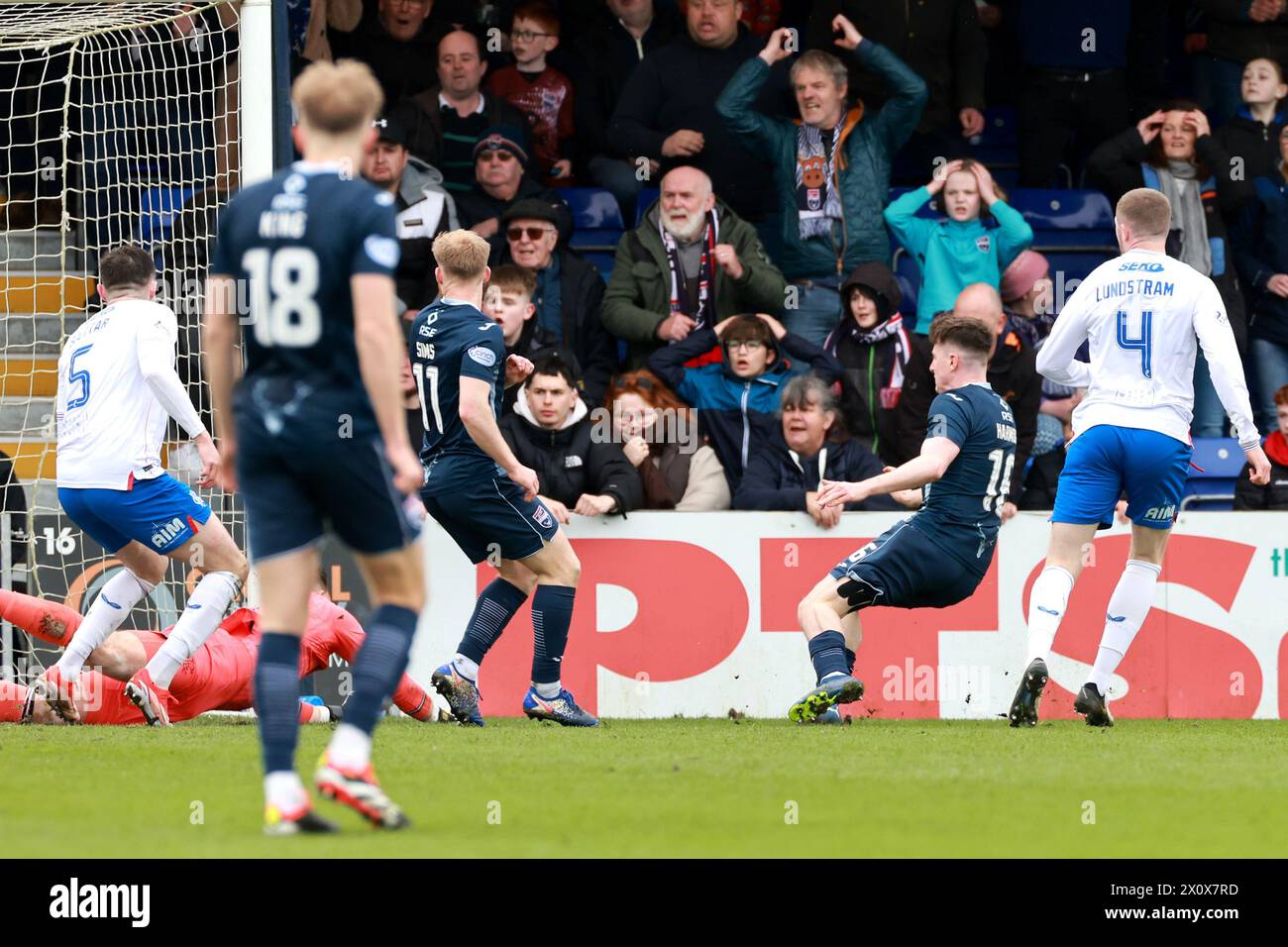 Ross County's George Harmon (second right) scores their side's second ...