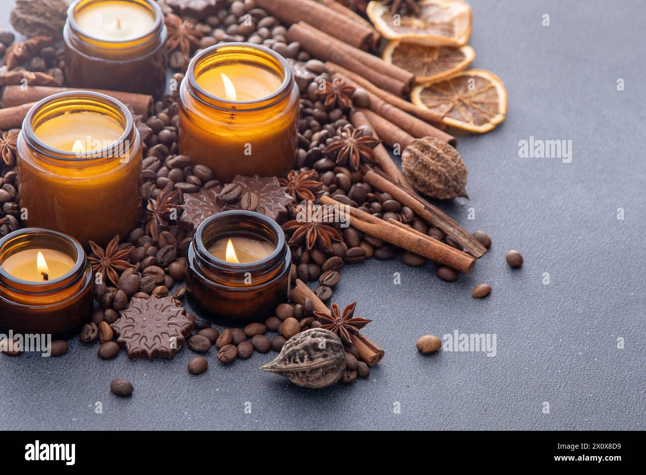 Soy scented candle in a jar. Coffee beans, anise, cinnamon spices. The ...