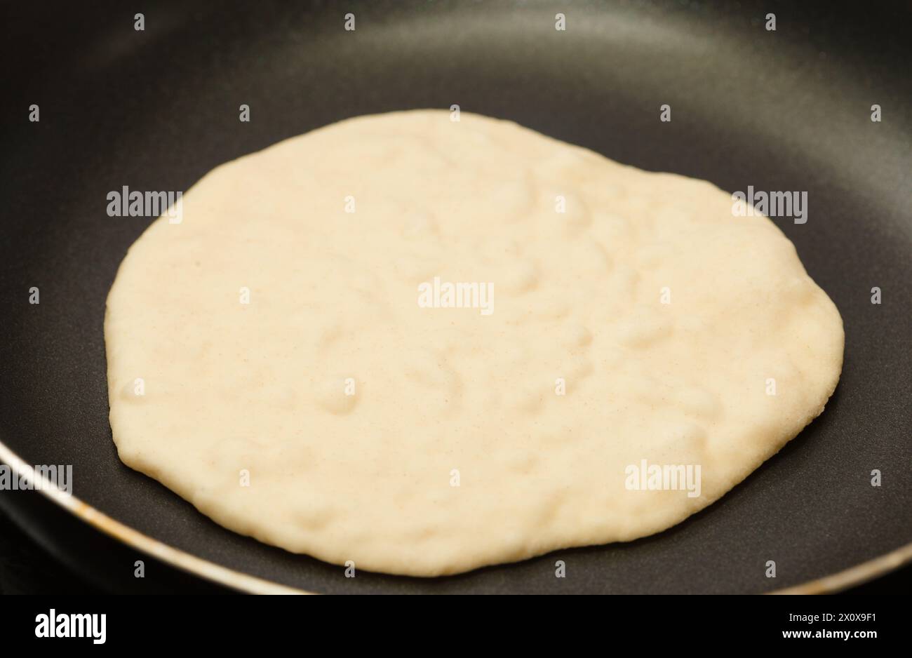 Making sourdough leavened pita-like flatbread on dry frying pan Stock ...