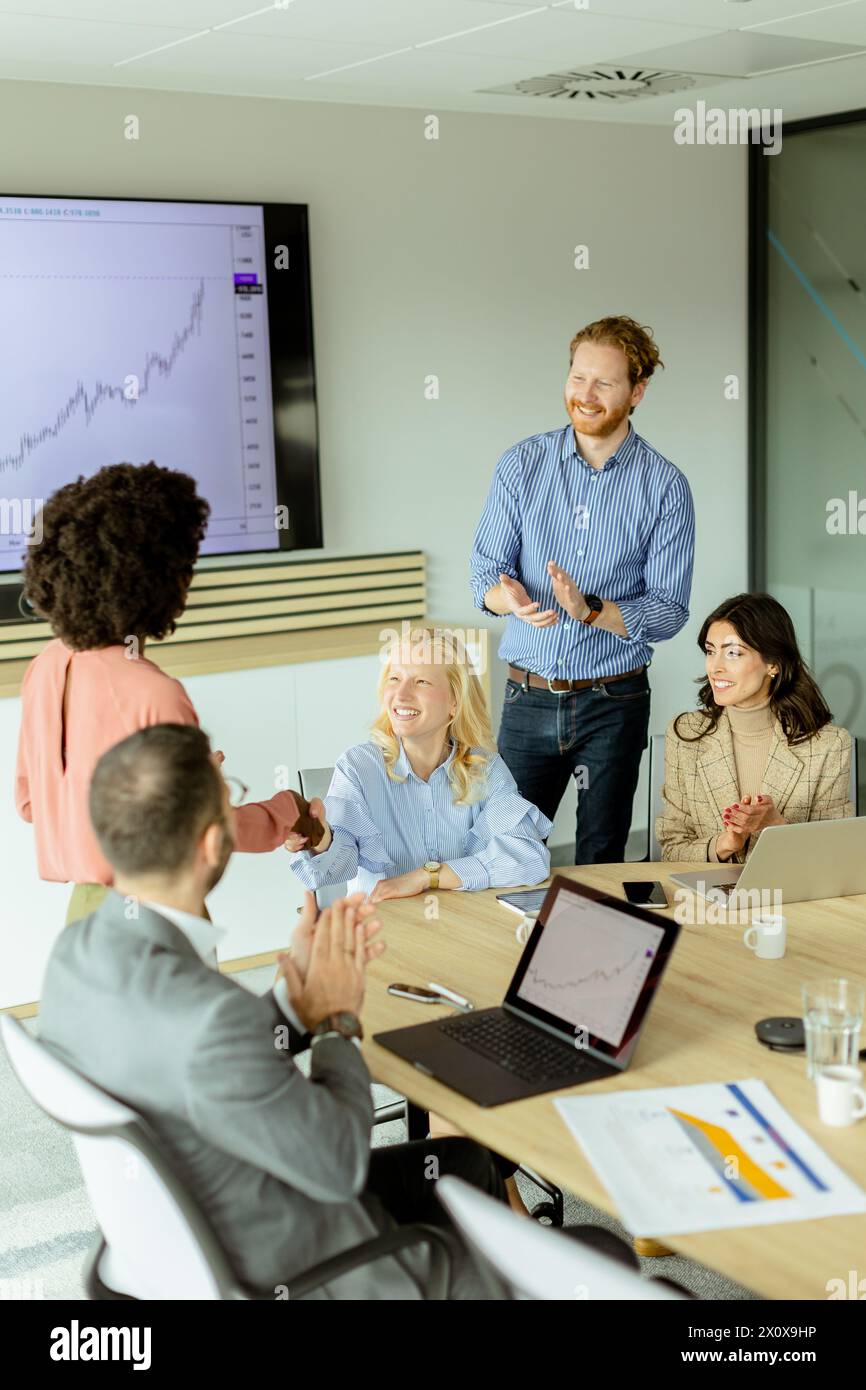 Multiethnic group of professionals brainstorming around a conference ...