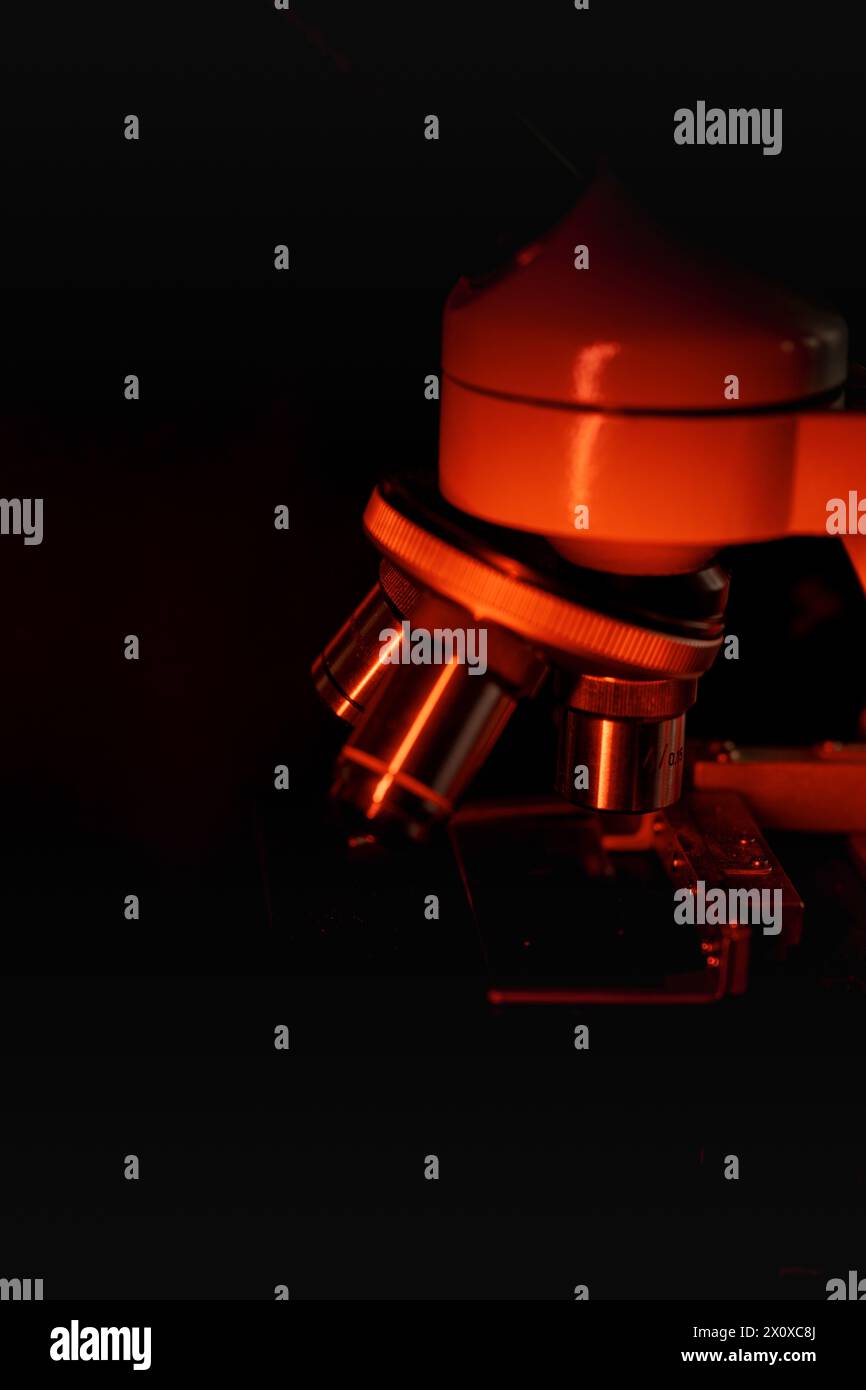 Medical microscope lenses close up, In warm red lighting Stock Photo ...