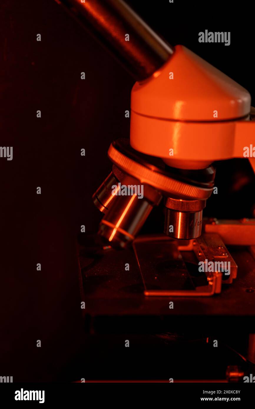 Medical microscope lenses close up, In warm red lighting Stock Photo ...