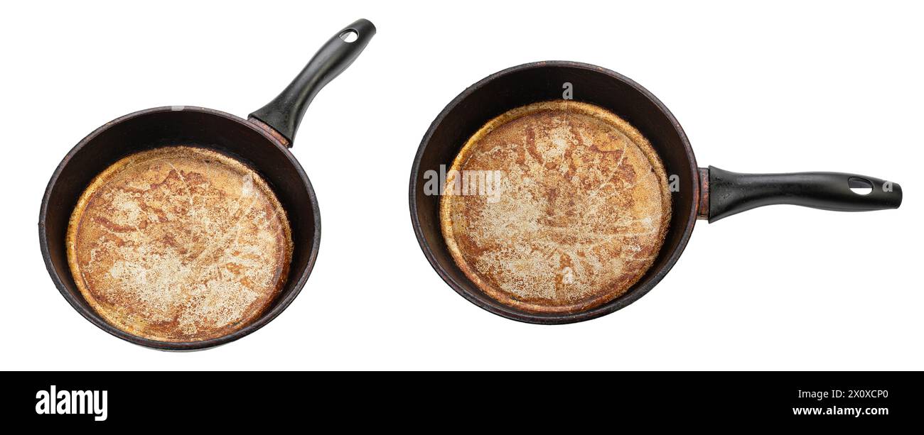 Two old empty frying pans isolated on a white background. File contains ...
