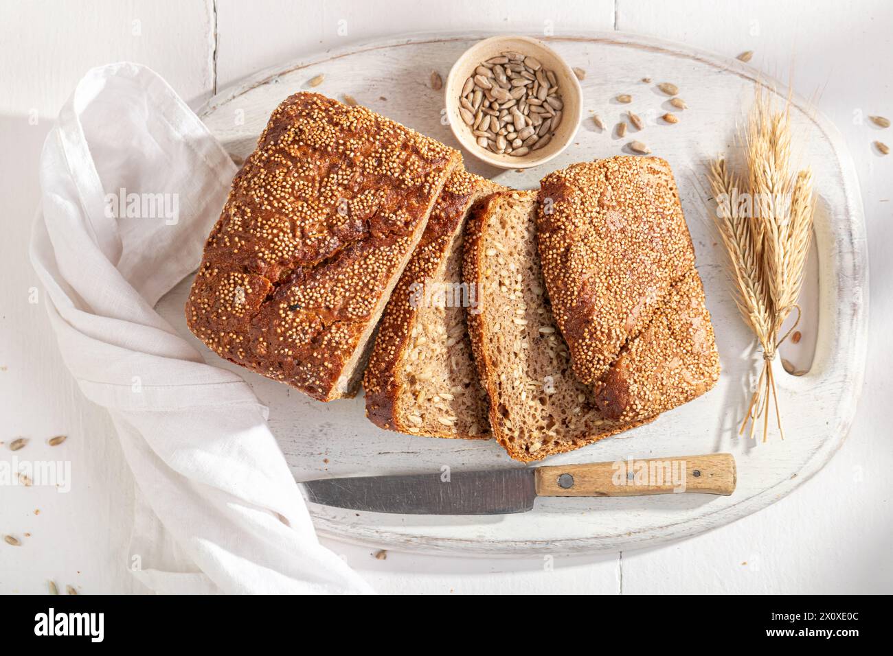 Square loaf of rye bread baked in home bakery. Rustic loaves of bread ...