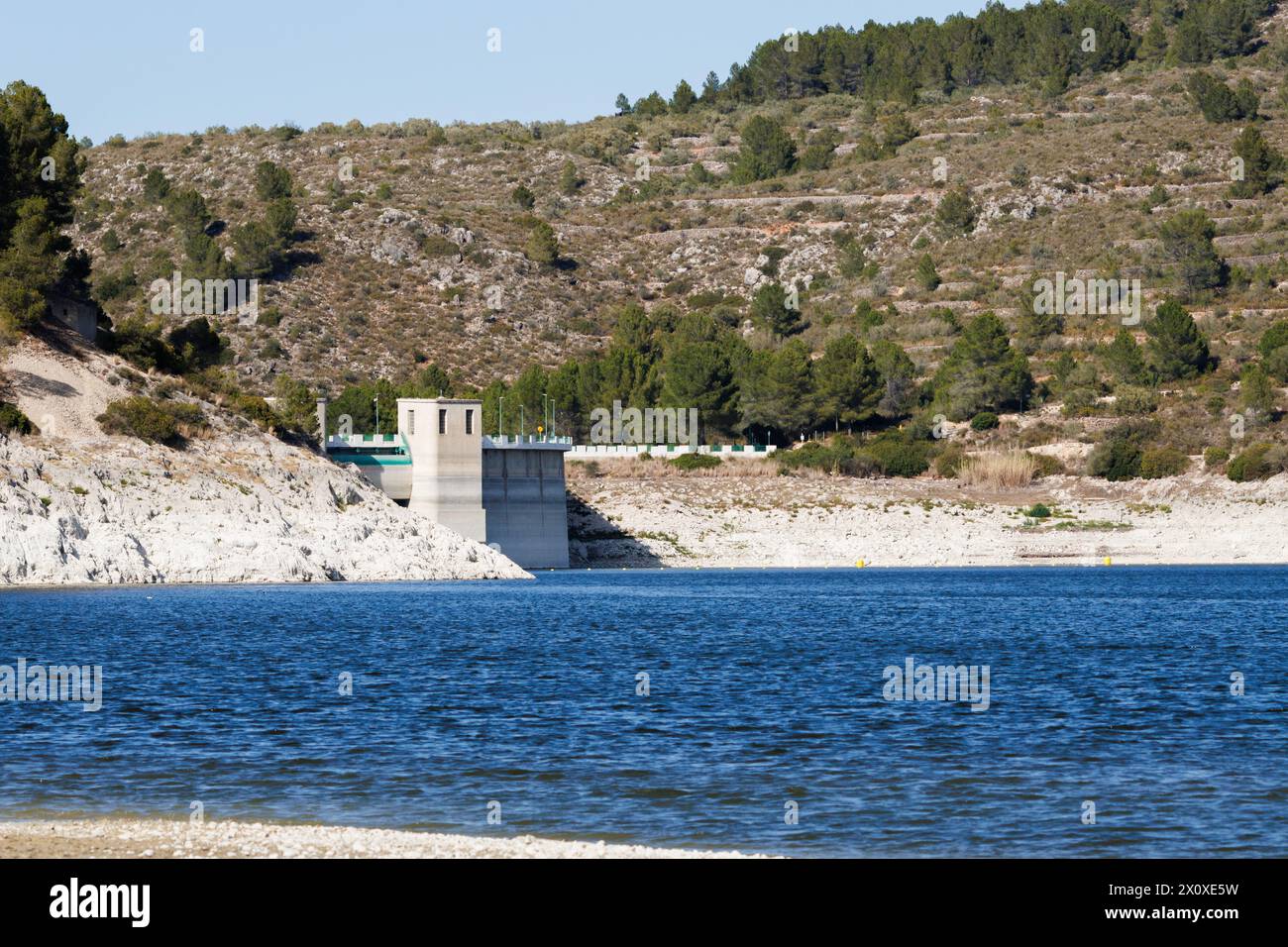 Landscape with the dam of the Beniarres reservoir, Spain Stock Photo ...