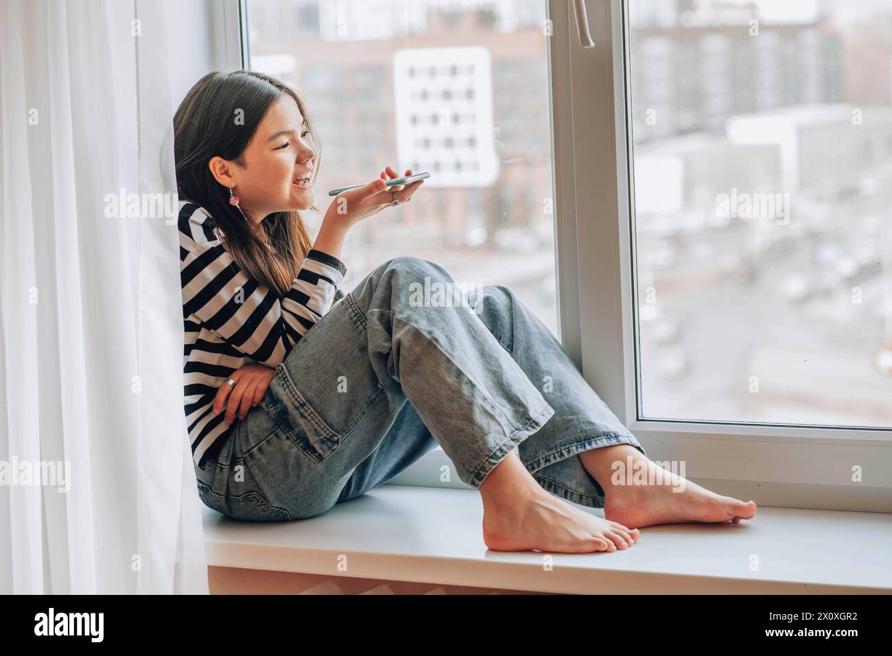 Urban Solitude : A serene moment of a young girl immersed in her ...