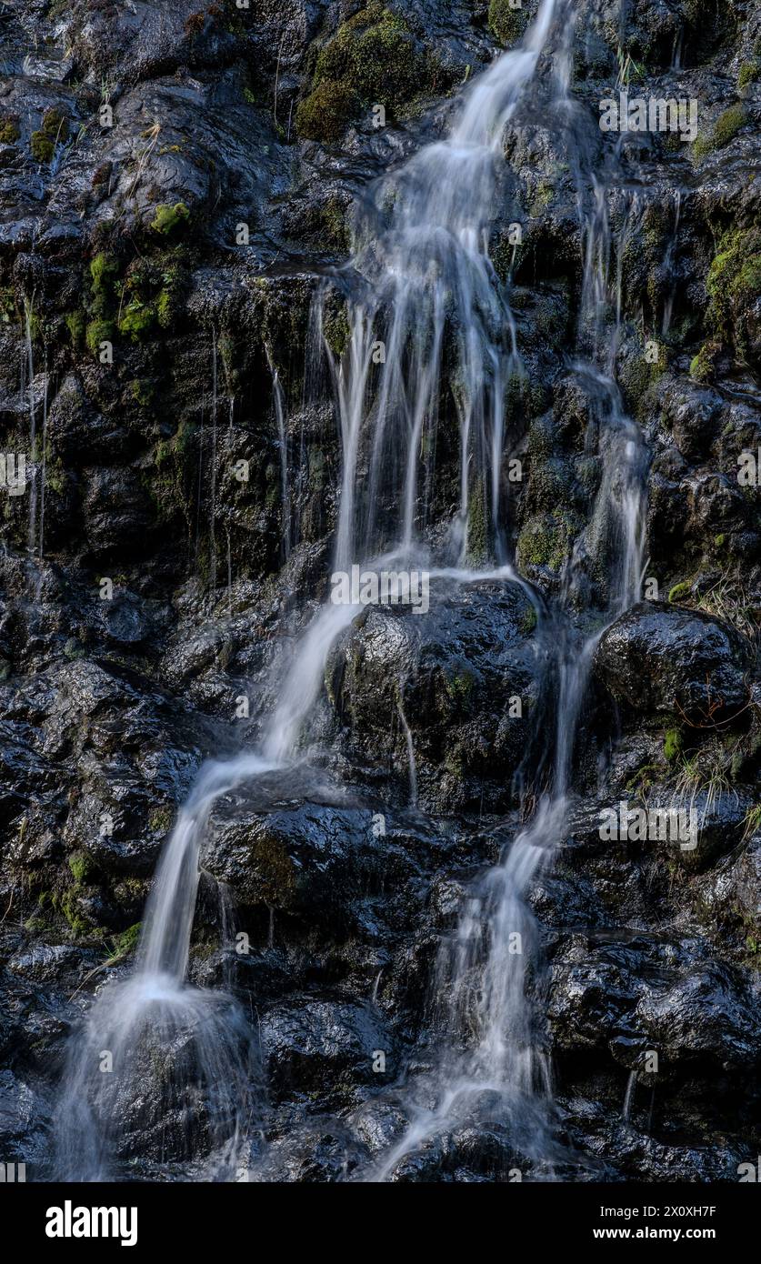 A waterfall cascading down rocks into the Sooke River in Sooke Potholes ...