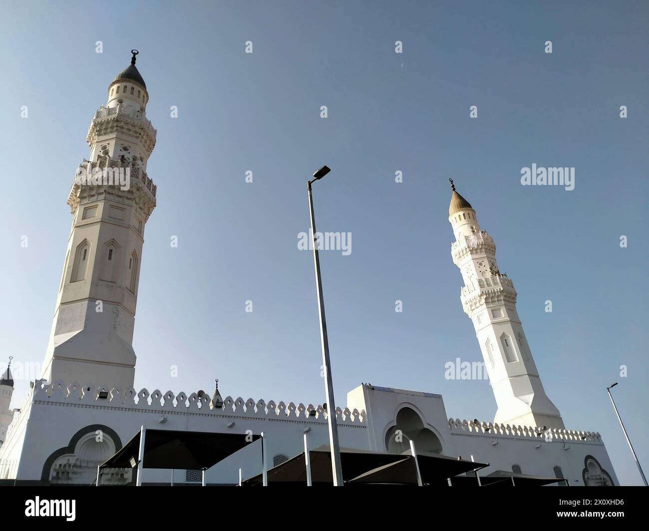 Tower of a mosque in Medina, Saudi Arabia in the morning with a gray ...