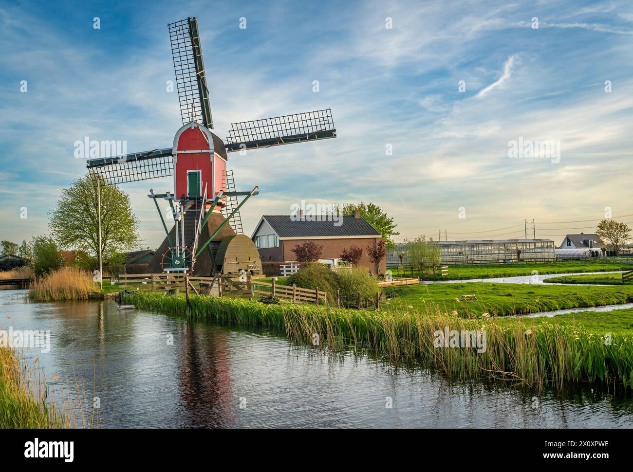 Traditional dutch windmill the Rooie Wip in the village of Hazerswoude ...