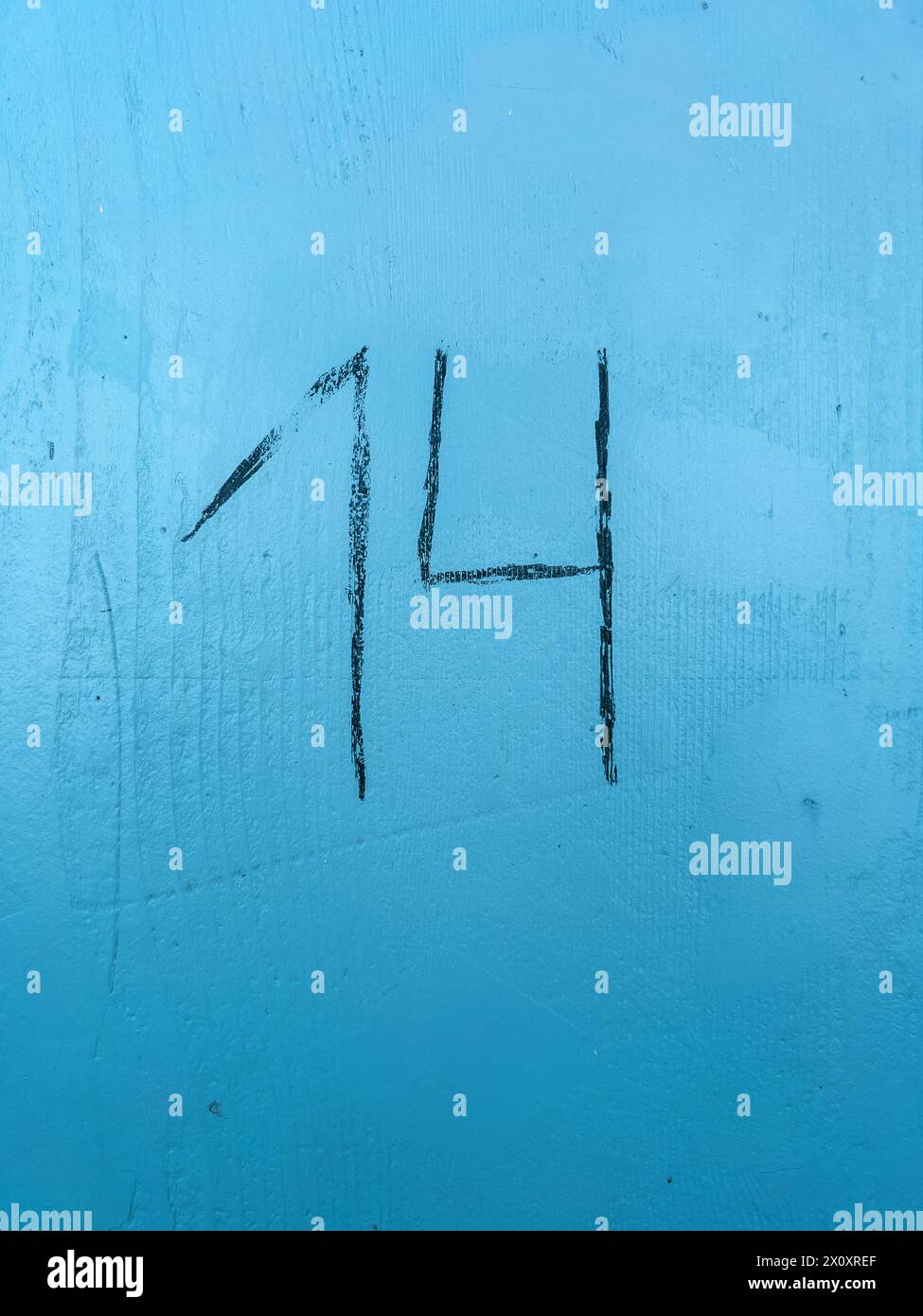 House number 14 written on blue wooden door, vertical image Stock Photo ...