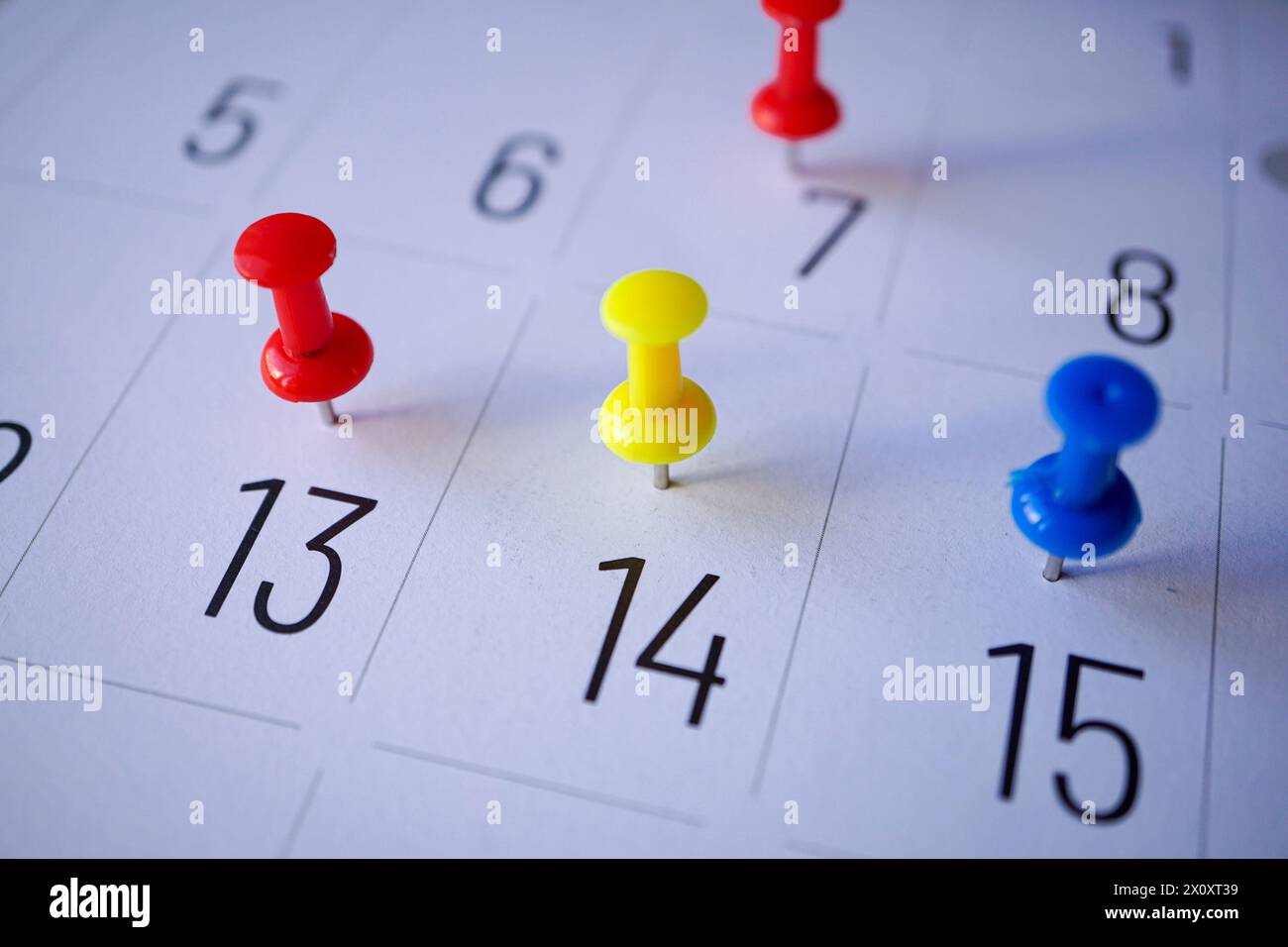 Drawing pin on the calendar, days of the month Stock Photo - Alamy