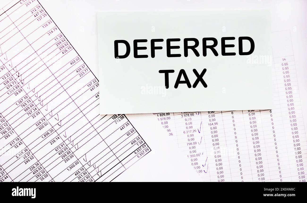 DEFERRED TAX text on notepad on graph and white background Stock Photo ...