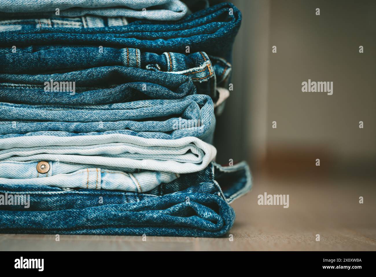 Stack of folded denim pants. Fashion, style, stock and store concept ...