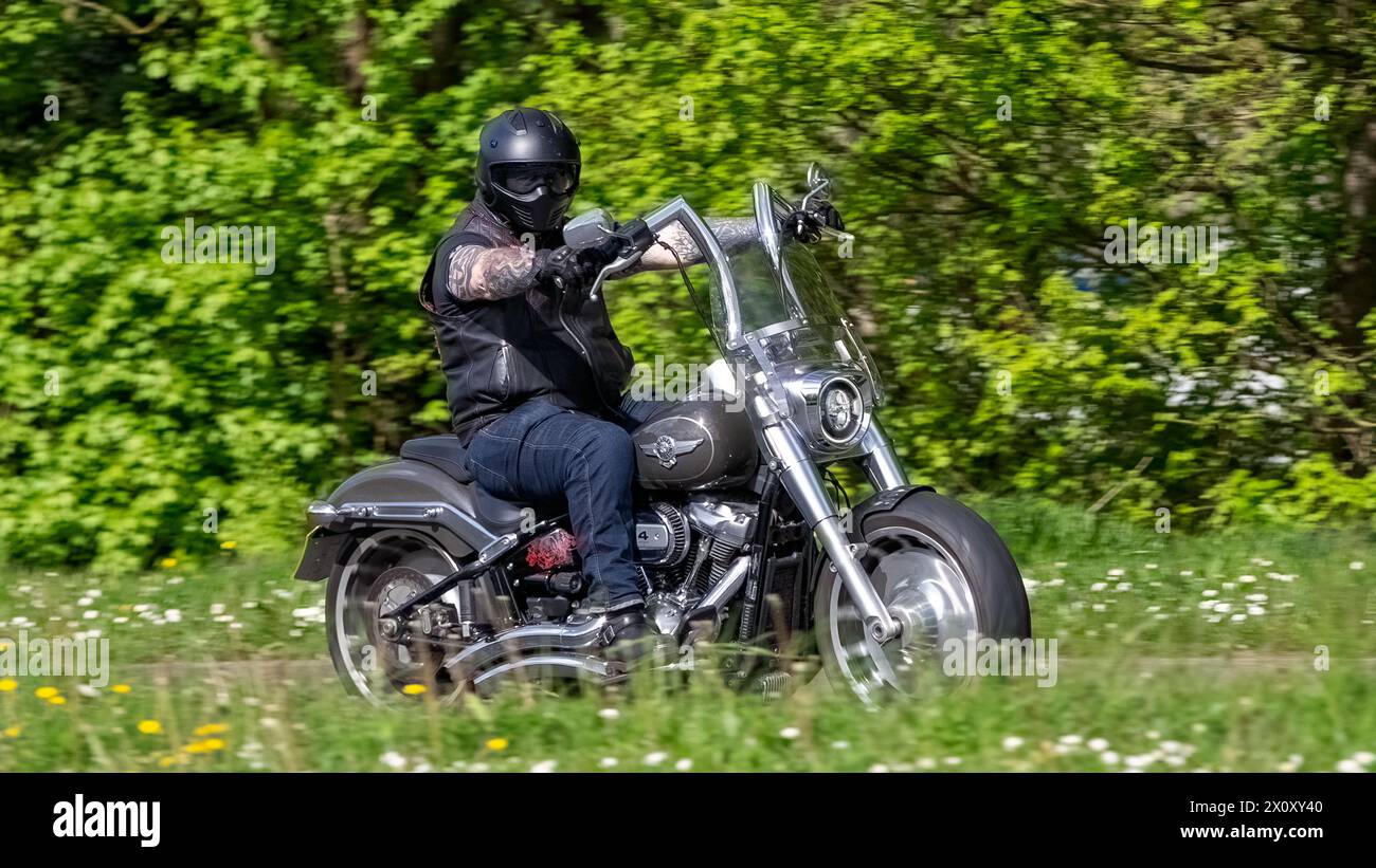 Milton Keynes,UK- Apr 14th 2024: Man riding a 2018 Harley Davidson ...