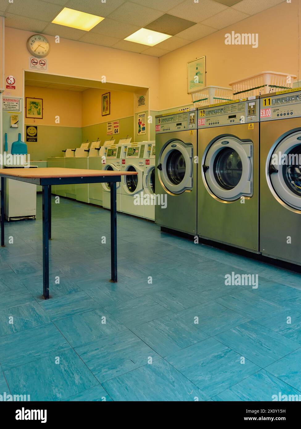 A typical laundromat / launderette interior with coin operated washing ...