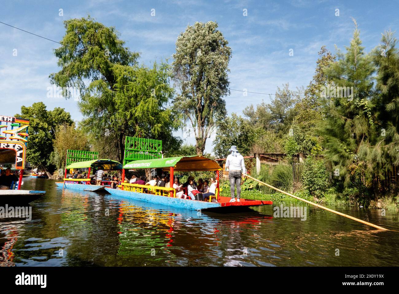 Tourists enjoy a day on Xochimilco boat tours, which offers a variety ...
