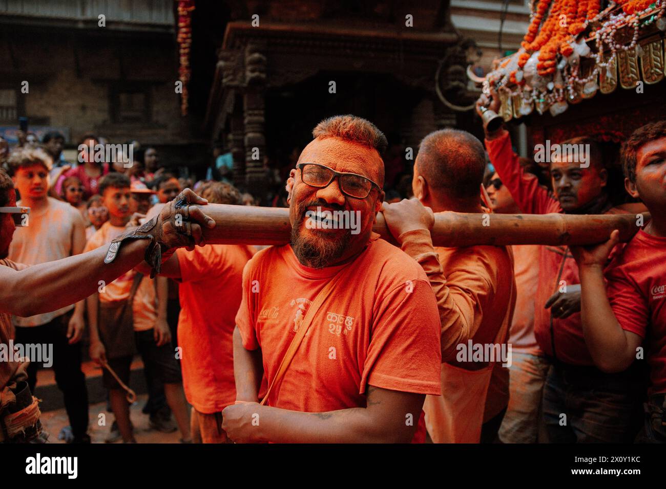 Nepalese devotees are carrying the chariot during the celebration of ...