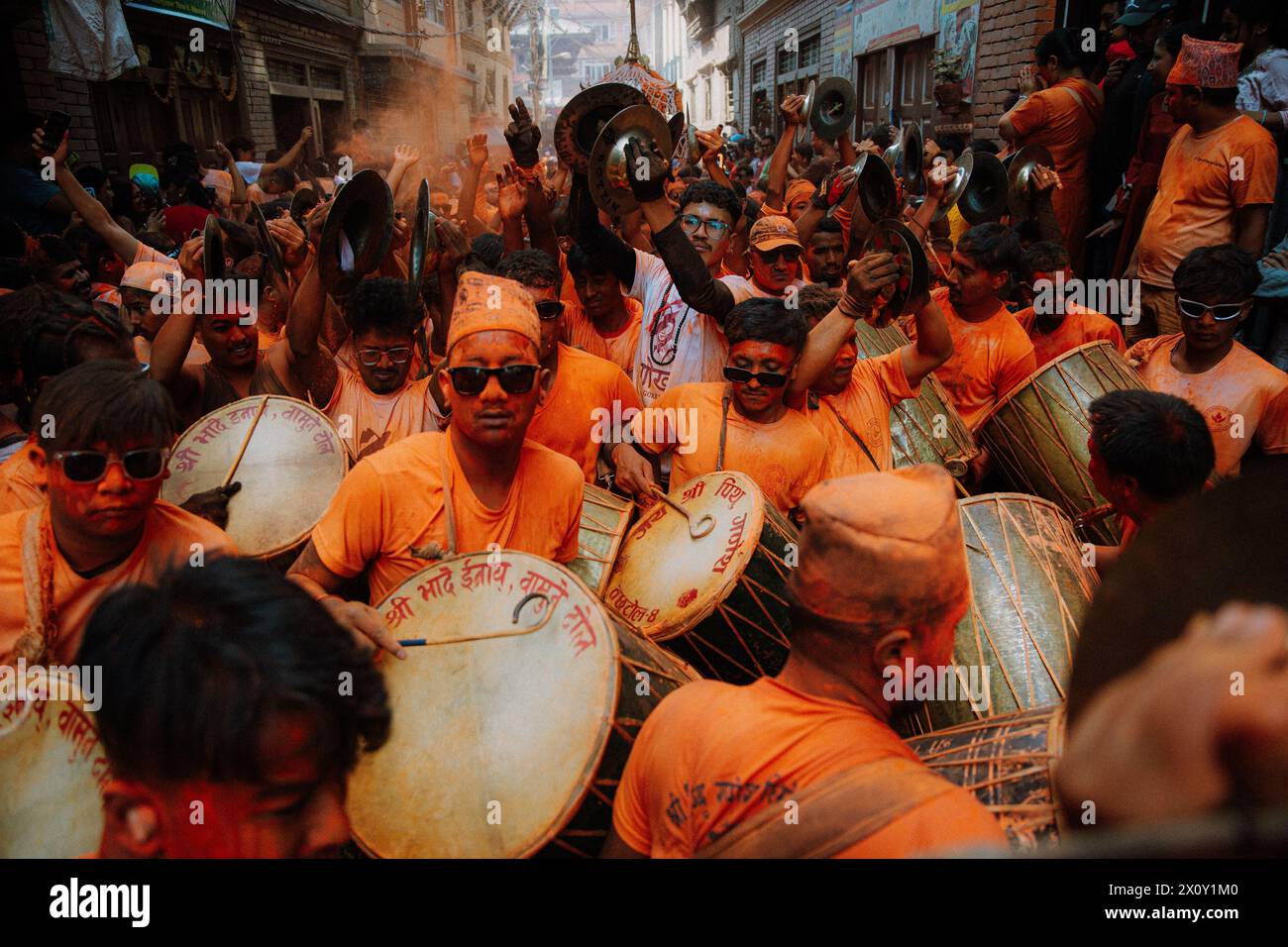 Nepalese devotees are dancing and playing traditional drums during the ...