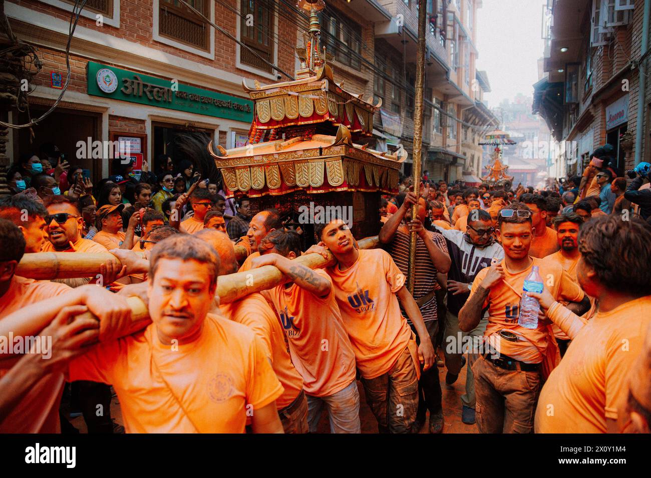 Nepalese devotees are carrying the chariot during the celebration of ...