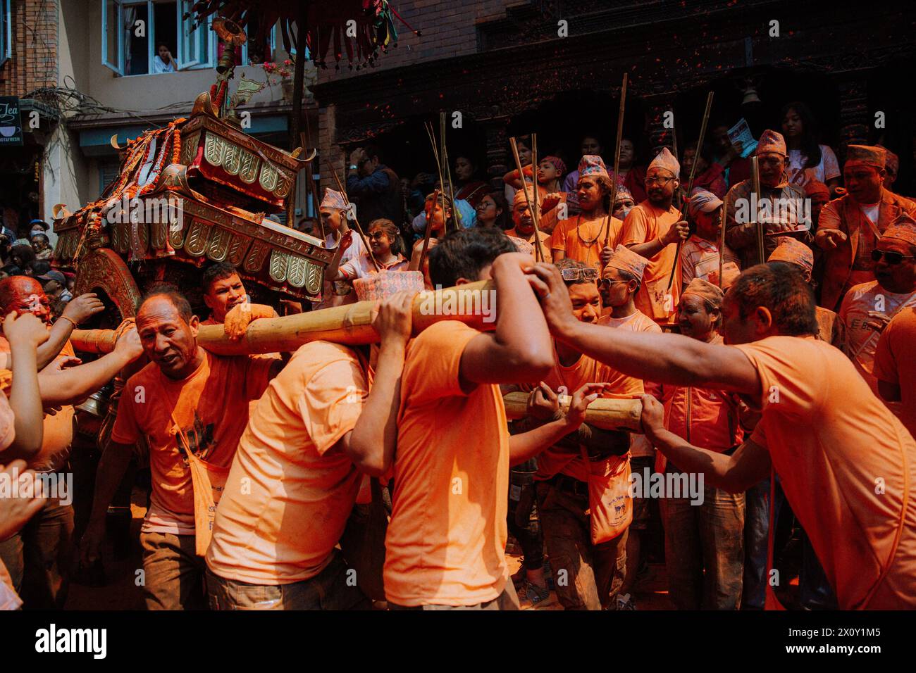 Nepalese devotees are carrying the chariot during the celebration of ...