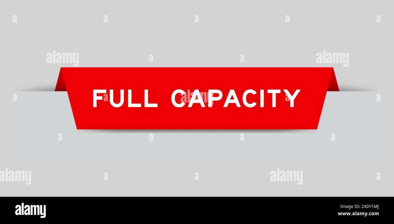 Red color inserted label with word full capacity on gray background ...