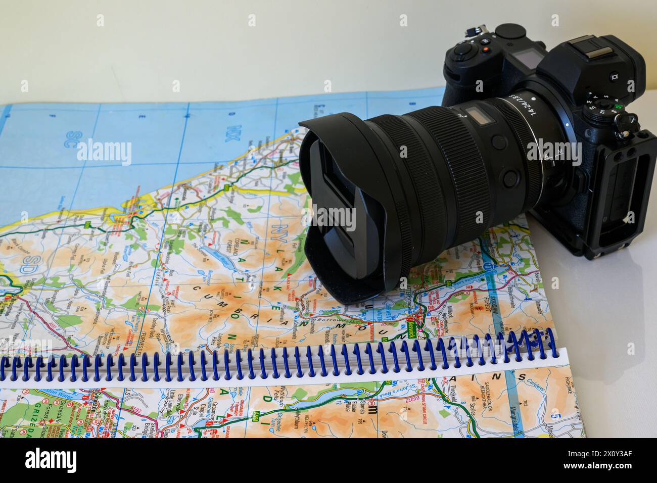 Professional camera and map planning shoot Stock Photo - Alamy