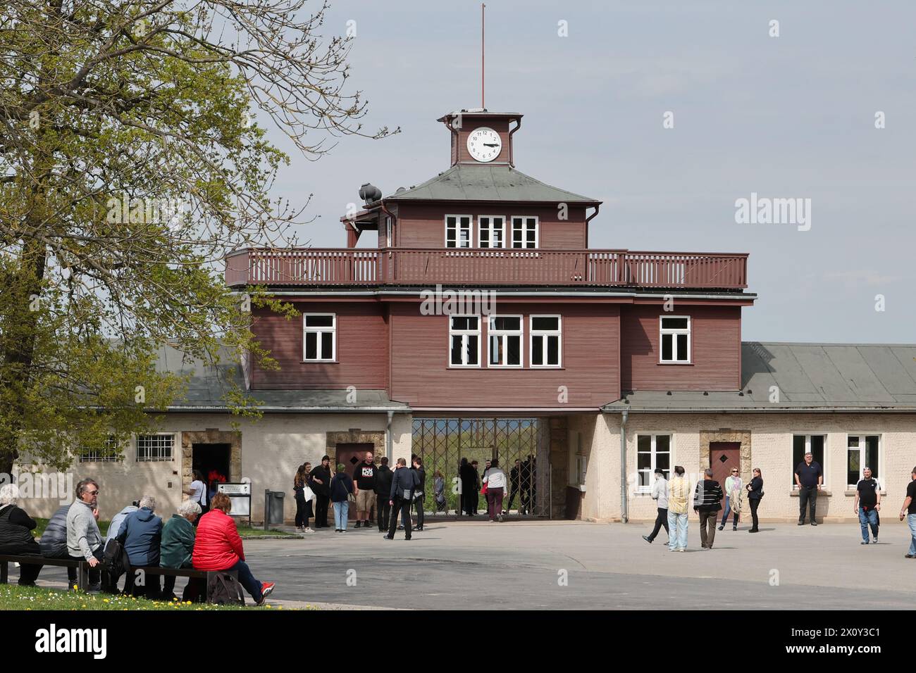 14 April 2024, Thuringia, Weimar: People stand at the former camp gate ...