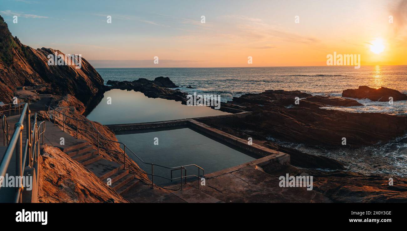 Aerial drone view of Blue Pool in Bermagui during sunrise sunset with ...