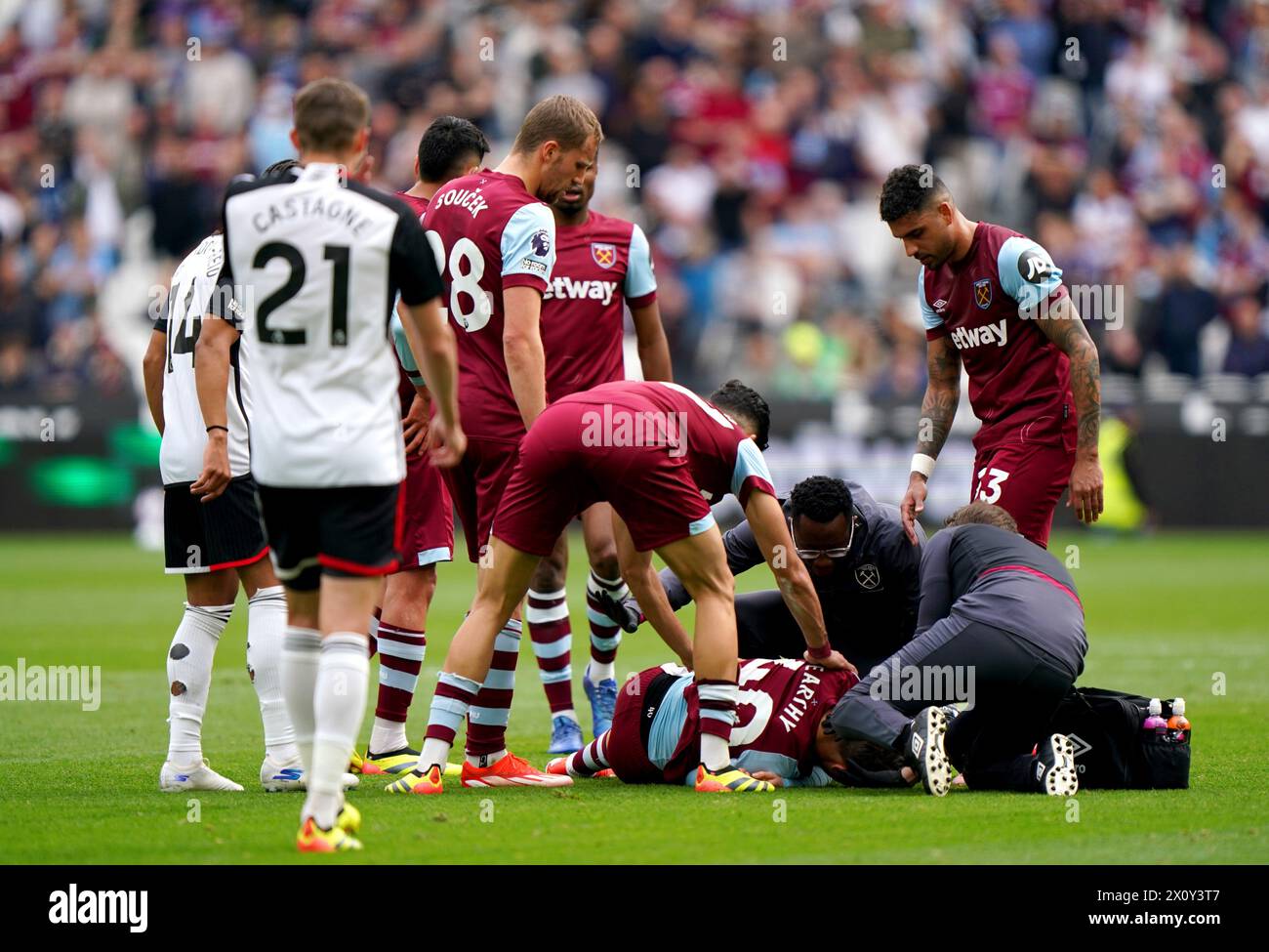 West Ham United's George Earthy requires medical attention after ...