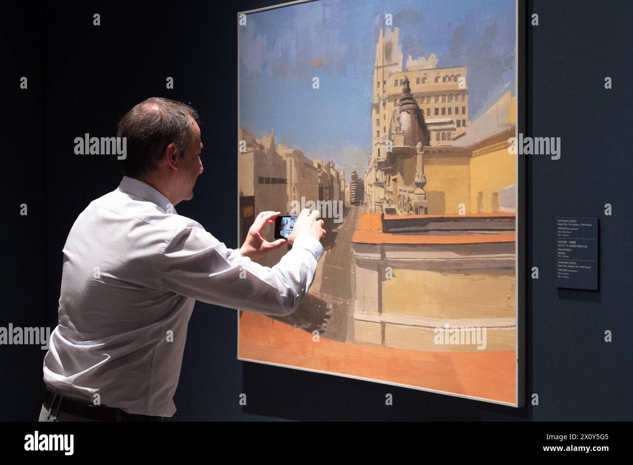 Madrid, Spain. 12th Apr, 2024. A visitor takes photos at an exhibition ...