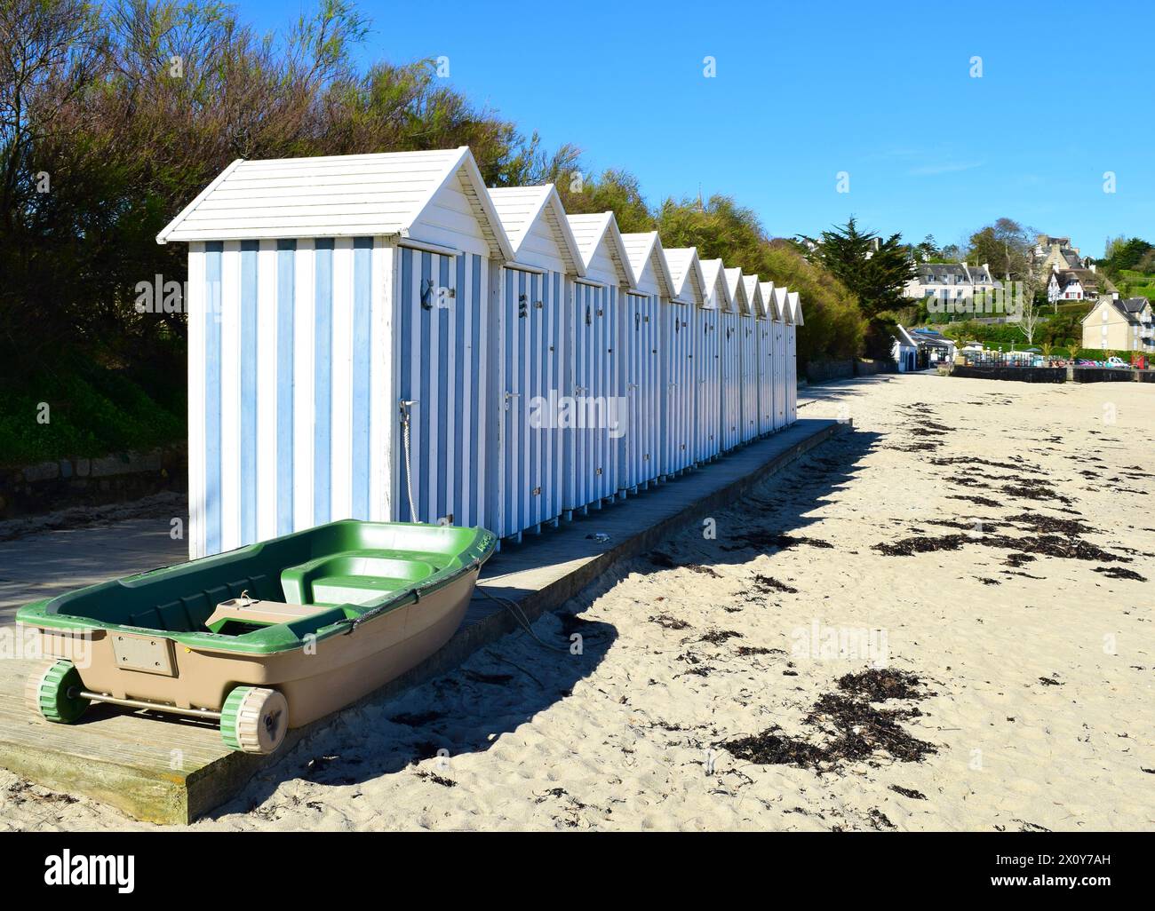 Row of beach huts on the sandy beach at Carantec Karanteg, Brittany ...
