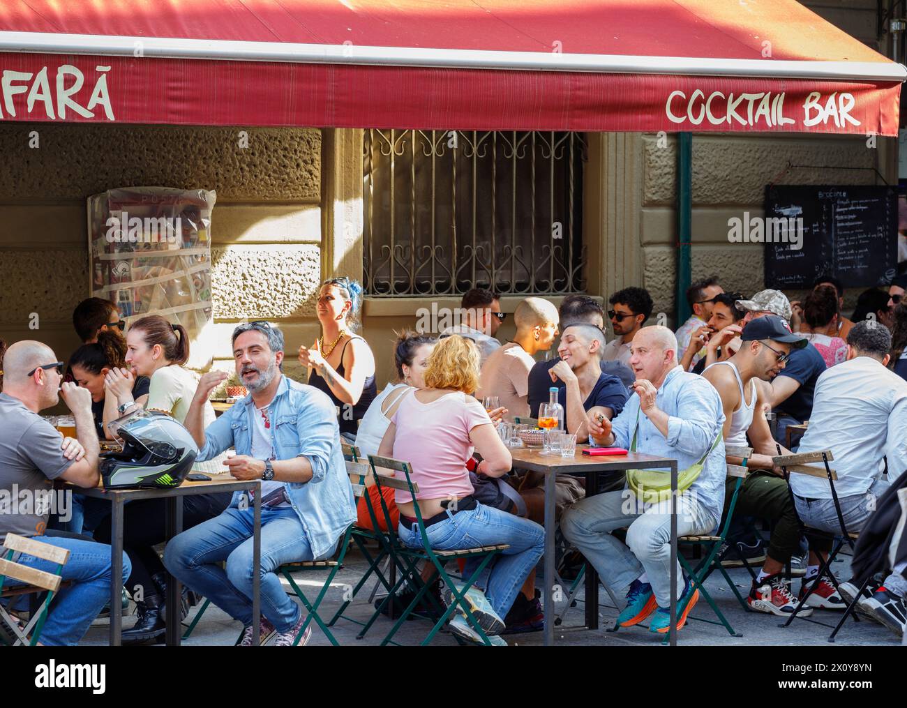 Turin, Italy - April 14, 2024: Customers in an outdoor bar at the ...