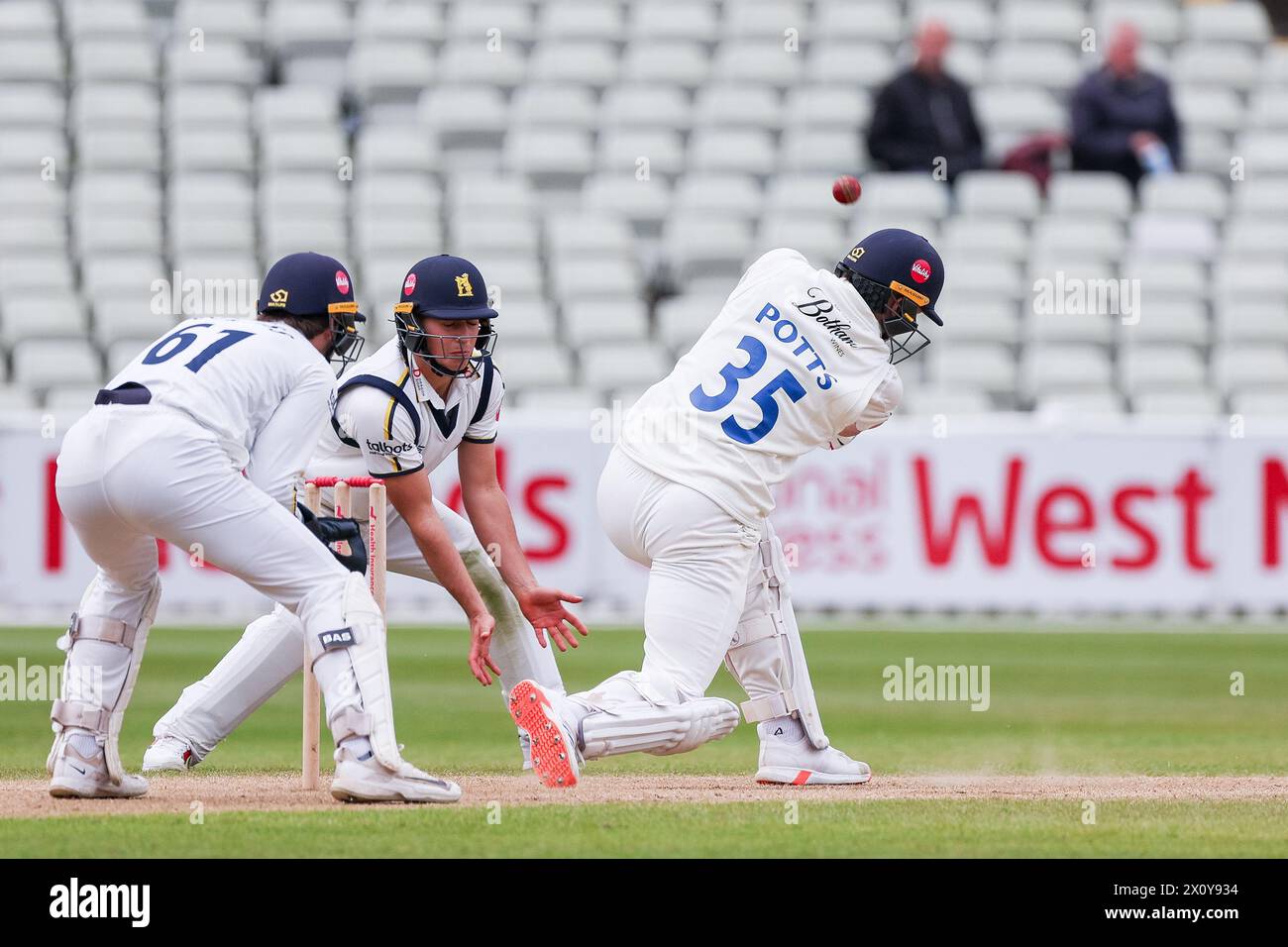 Durham's Matthew Potts hits the ball from Warwickshire's Danny Briggs ...