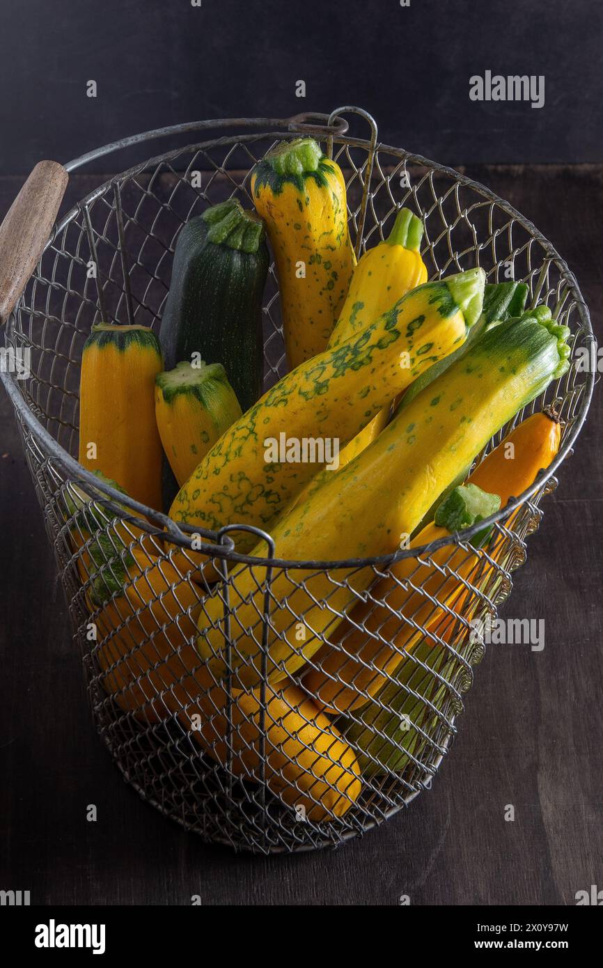 Yellow green leopard spotted zucchini. Vegetables on the table ...