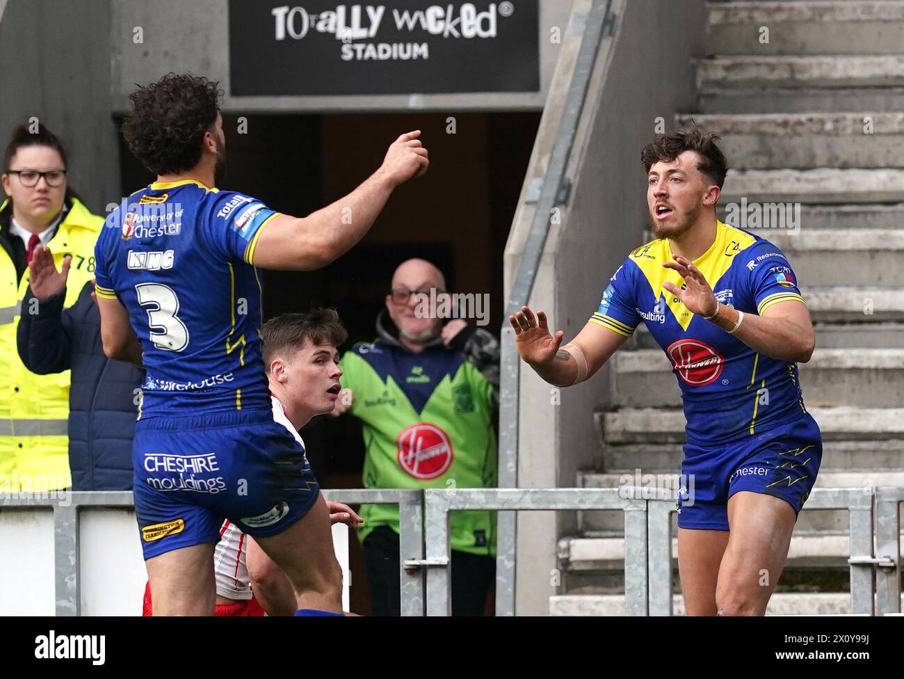 Warrington Wolves' Matty Ashton (right) celebrates scoring their side's ...
