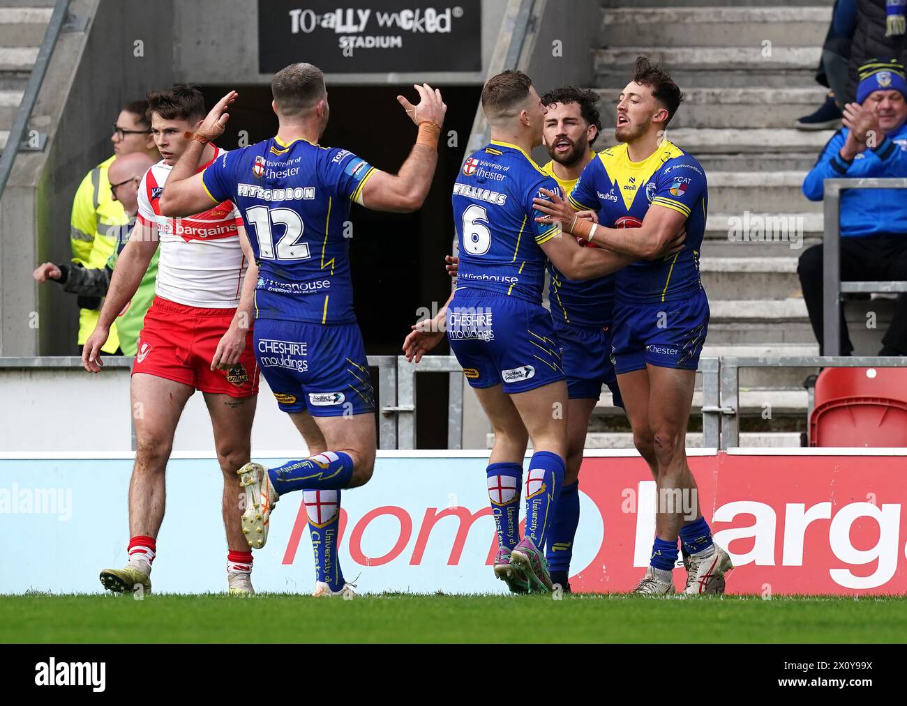 Warrington Wolves' Matty Ashton (right) celebrates scoring their side's ...