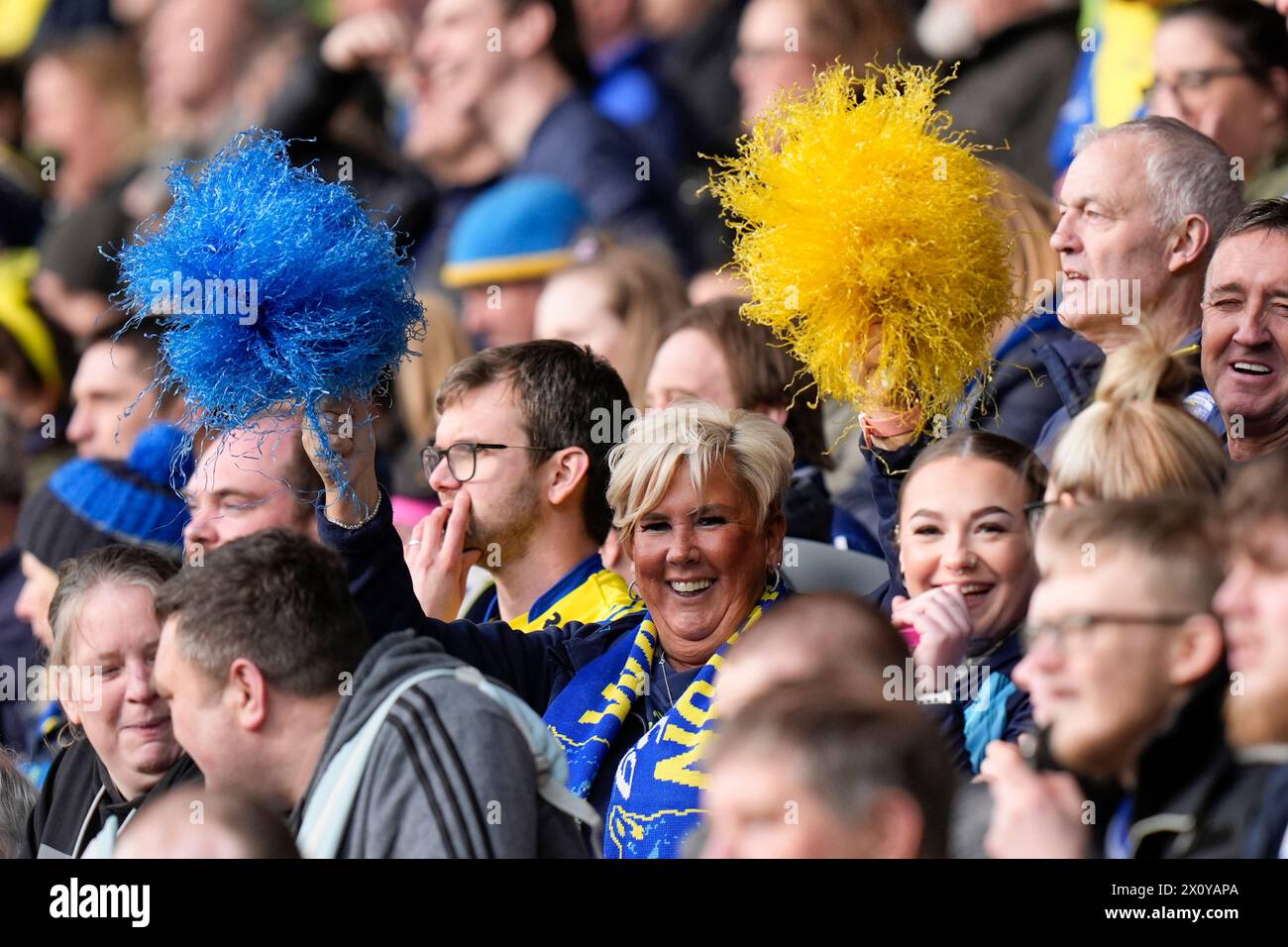 St Helens, UK. 14th Apr, 2024. Wire fans celebrate a try during the Betfred Challenge Cup ...