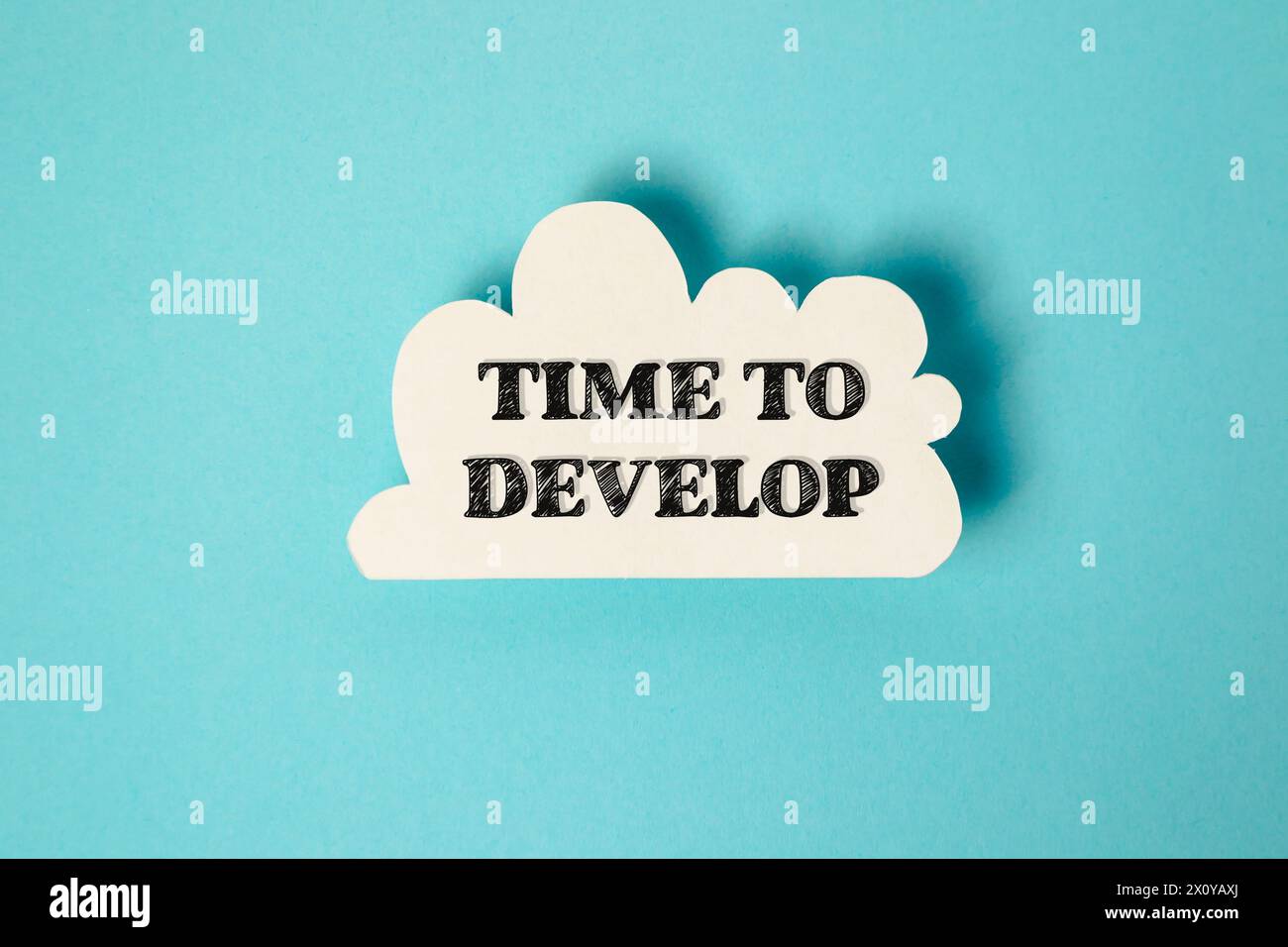 A white cloud with the words Time to Develop written in black. Concept ...