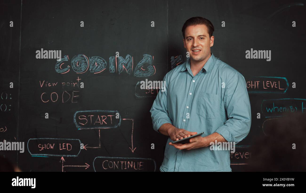 Professional happy teacher answering student question about coding ...