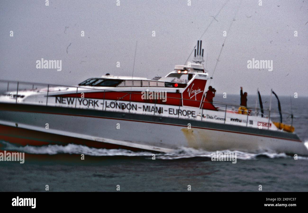 Richard Branson crosses the finishing line on June 29, 1986 in his ...