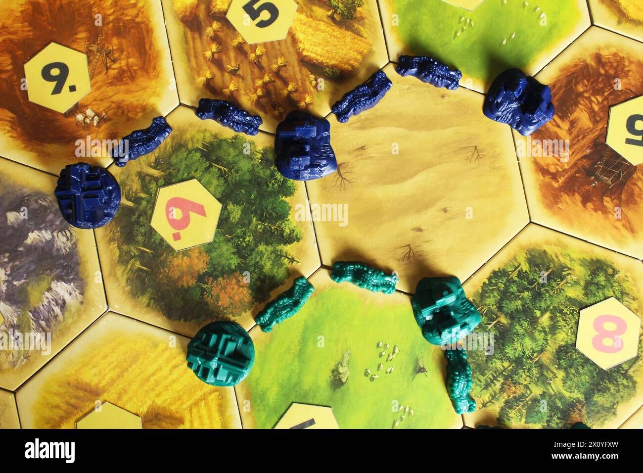 Mozyr, Belarus, April 01 2024: A catan board game blue and green chips ...