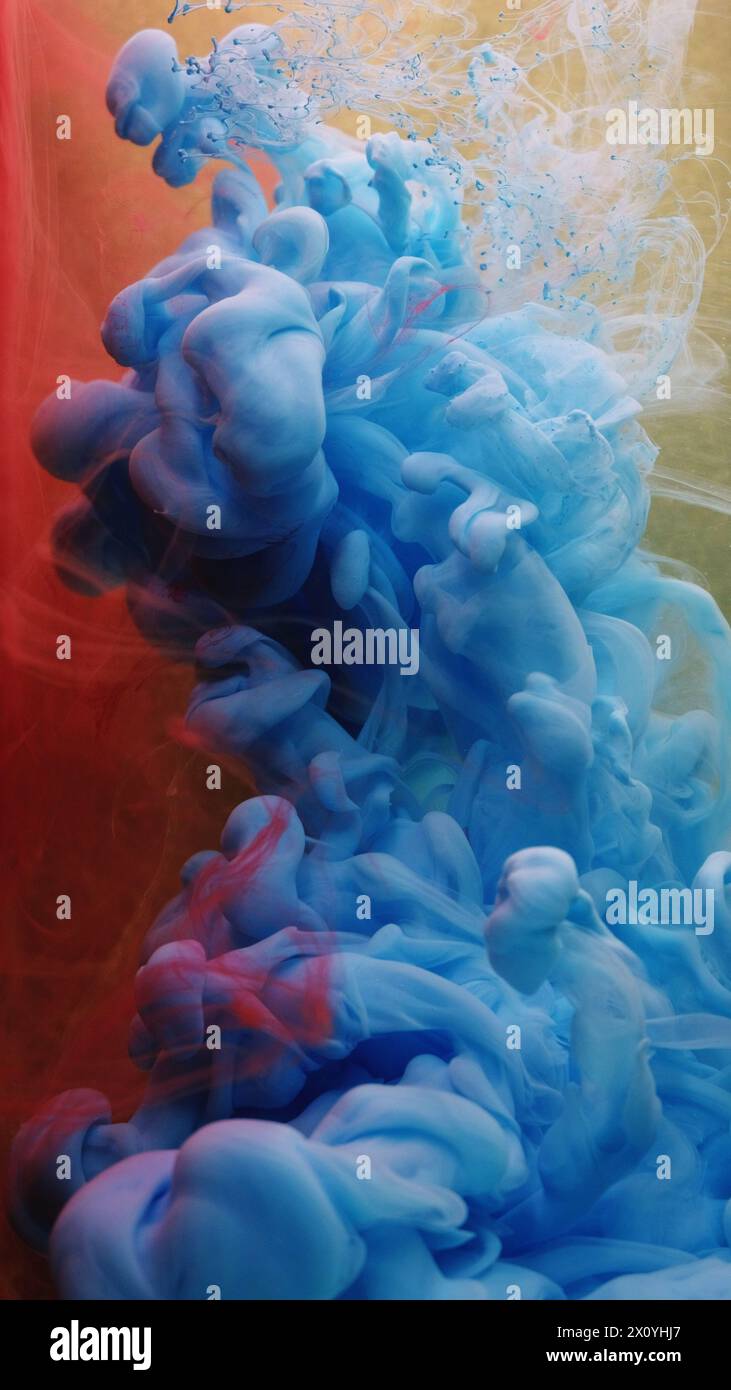 Ink water splash. Fluid smoke. Bright blue red color steam texture ...