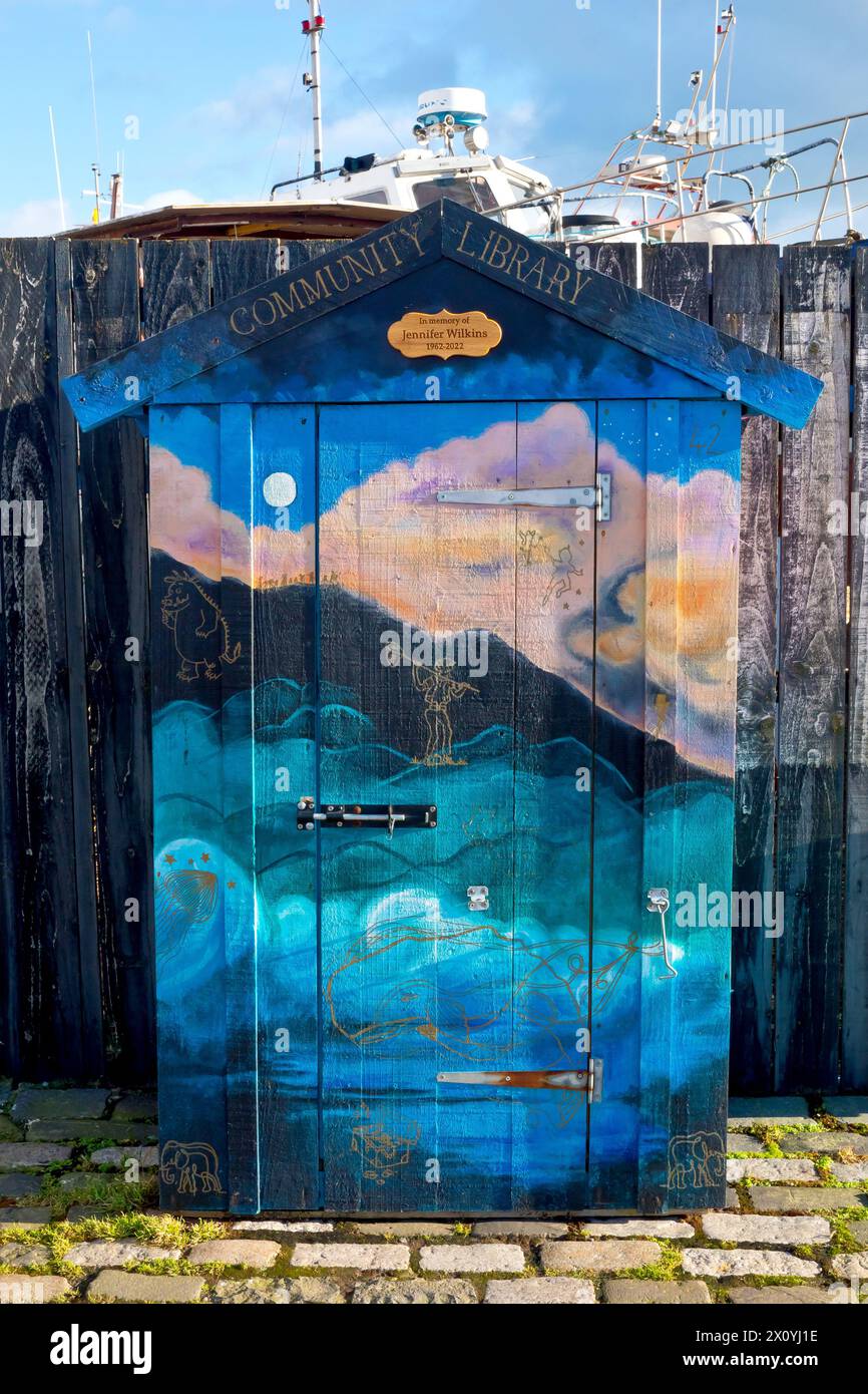 A small brightly painted shed set up at Arbroath harbour as a community ...
