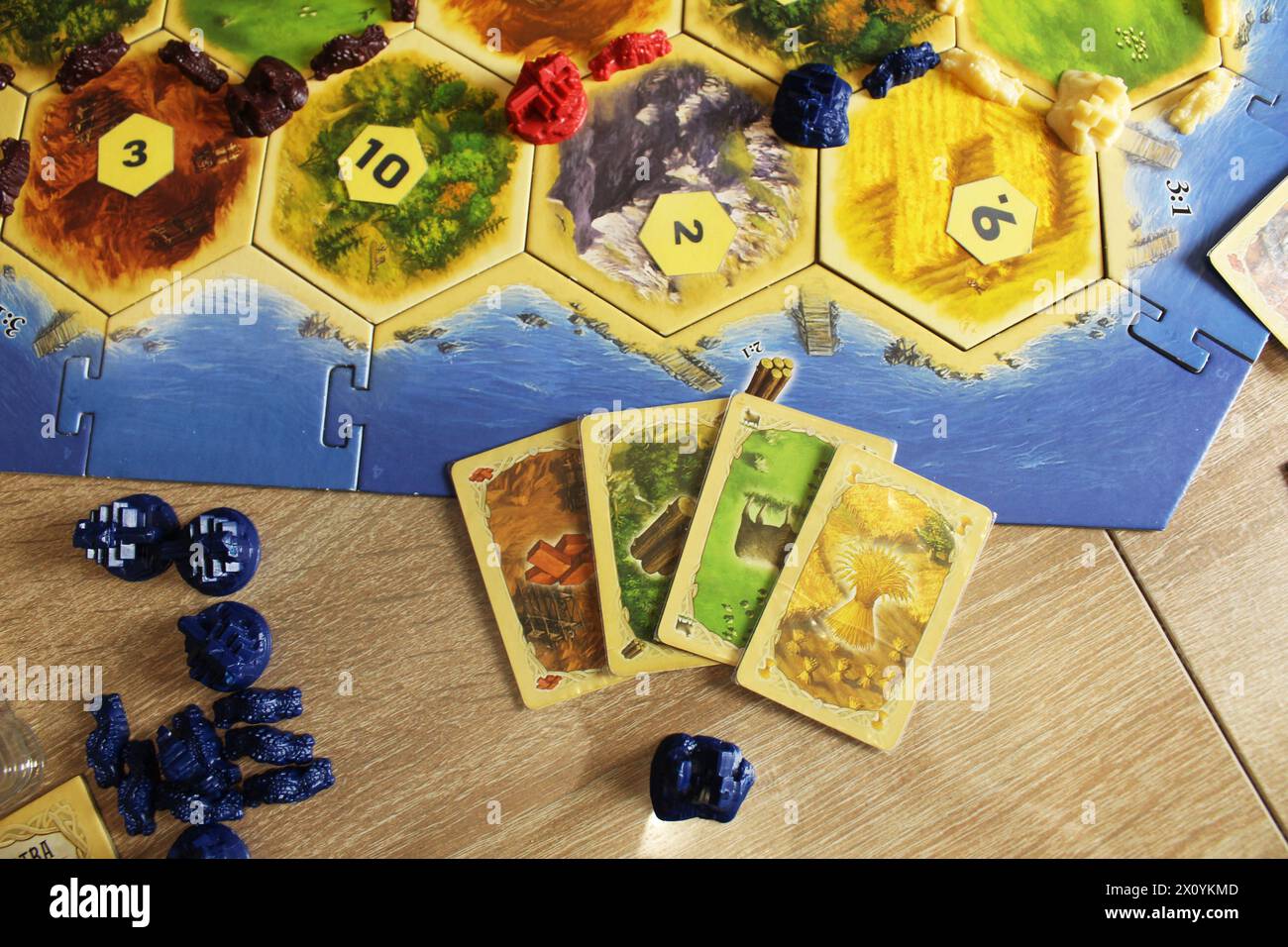 Mozyr, Belarus, April 01 2024: A catan board game buying a settlement ...