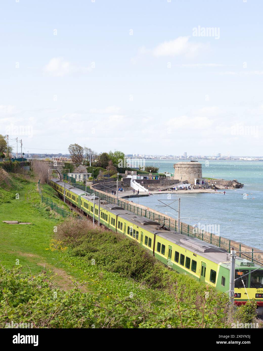 Train on a sceninc route around Seapoint beach in Ireland next to the ...