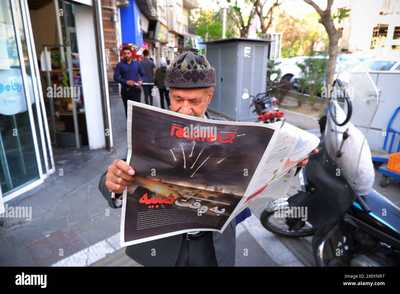 Tehran, Iran. 14th Apr, 2024. An Iranian elderly man holds a Jam-e Jam ...