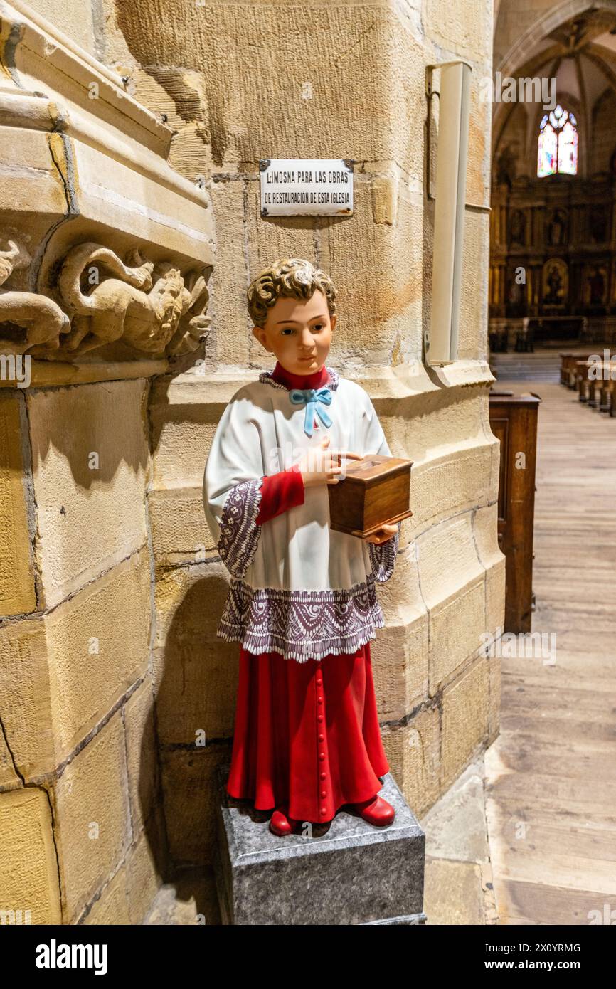 Statue of an altar boy asking alms hi-res stock photography and images ...