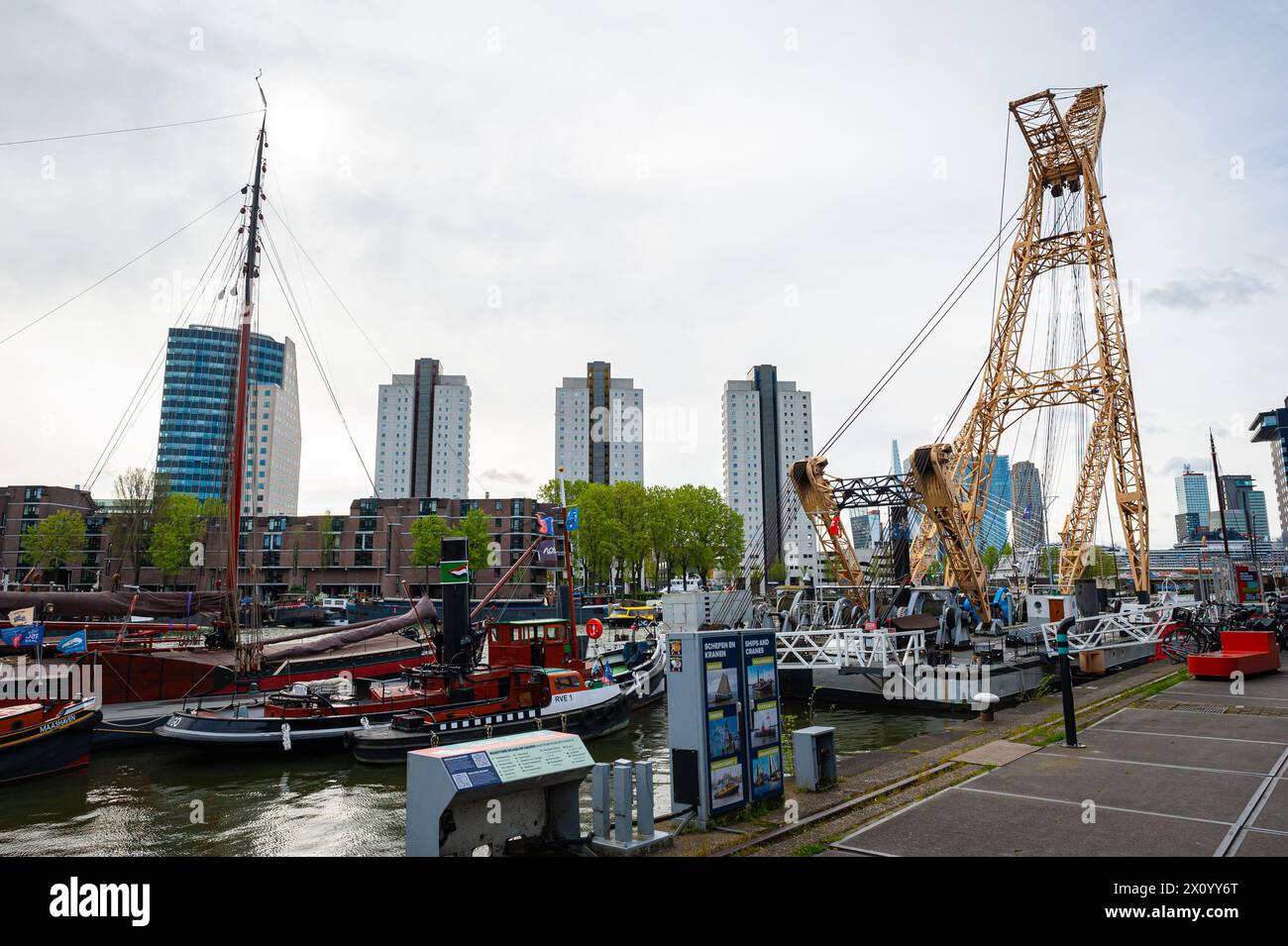 Crane and old-fashioned boats at the maritime museum at Leuvehaven in ...