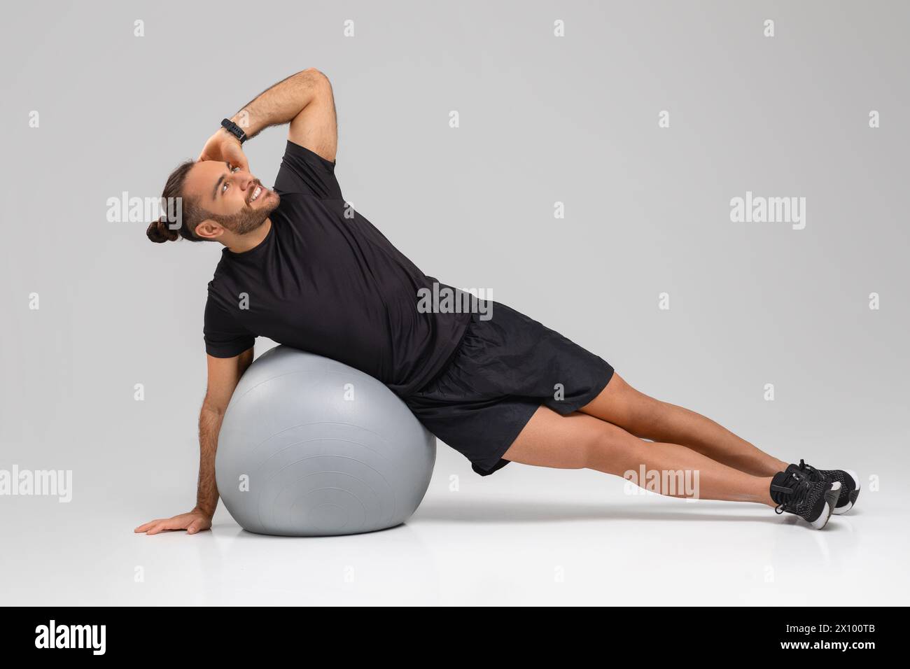 Man on gym ball hi-res stock photography and images - Alamy